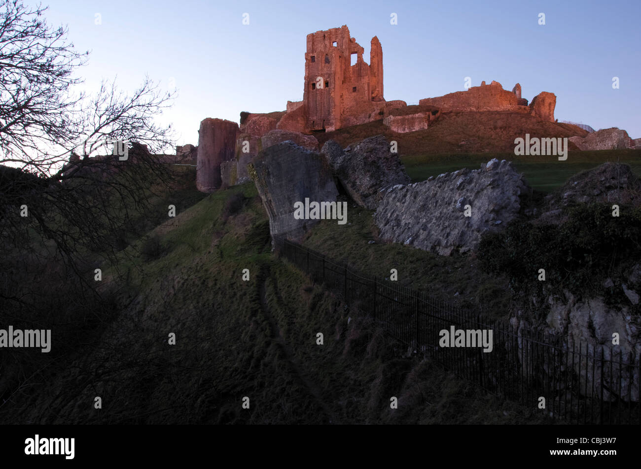 The great rugged ruin of Corfe Castle, with its broken down walls and ...