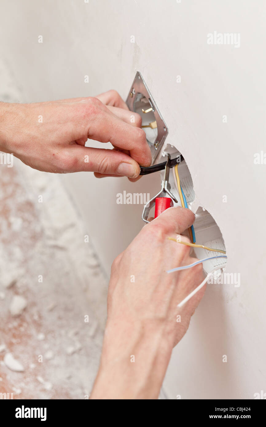 The hands of an electrician Stock Photo - Alamy