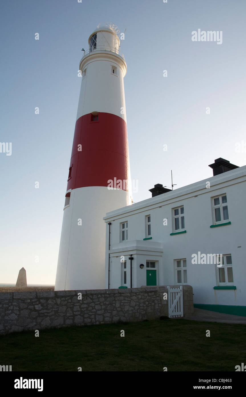 The Trinity House Lighthouse at Portland Bill, lit by the rays of the ...