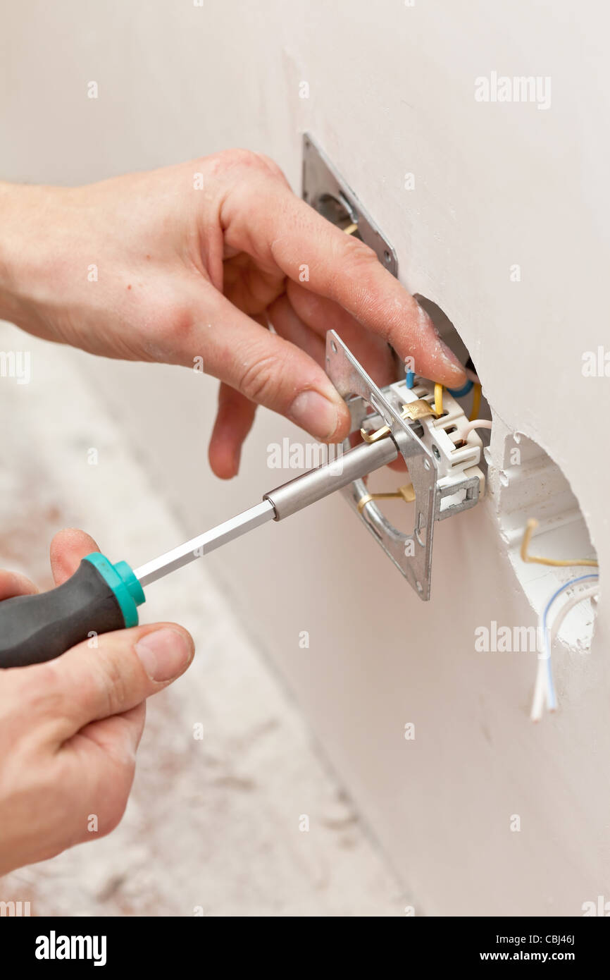 The hands of an electrician Stock Photo - Alamy