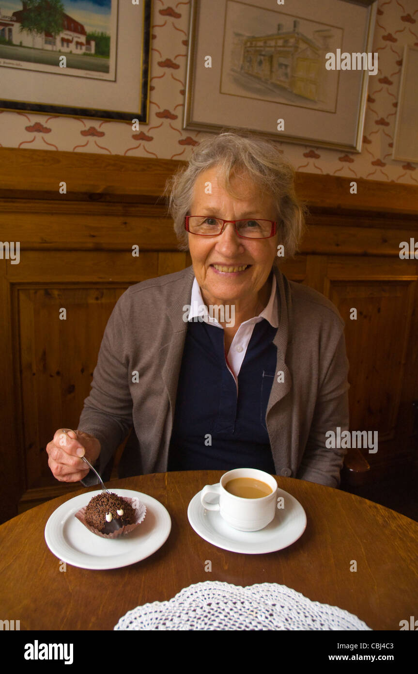 Female in her early 70s having coffee and cake Finland Europe Stock ...