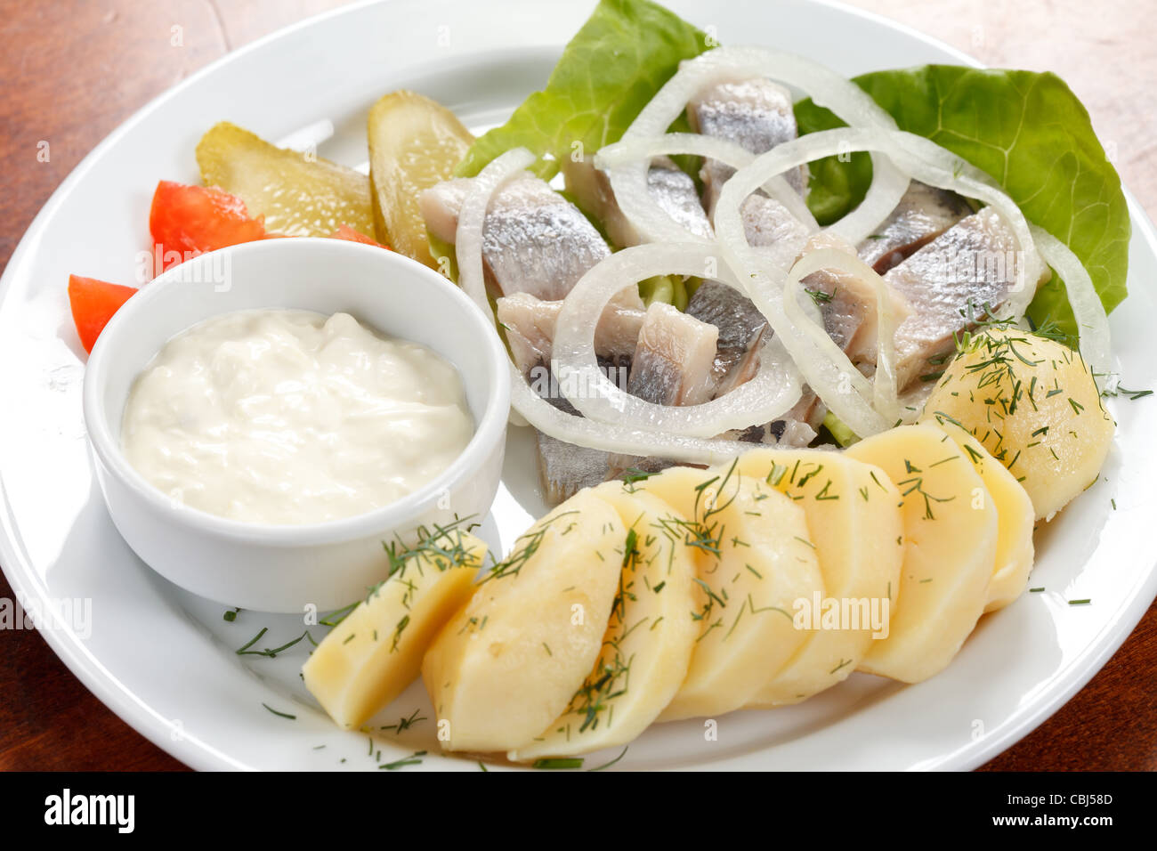 Matjes with Potatoes and Mayonnaise Stock Photo - Alamy