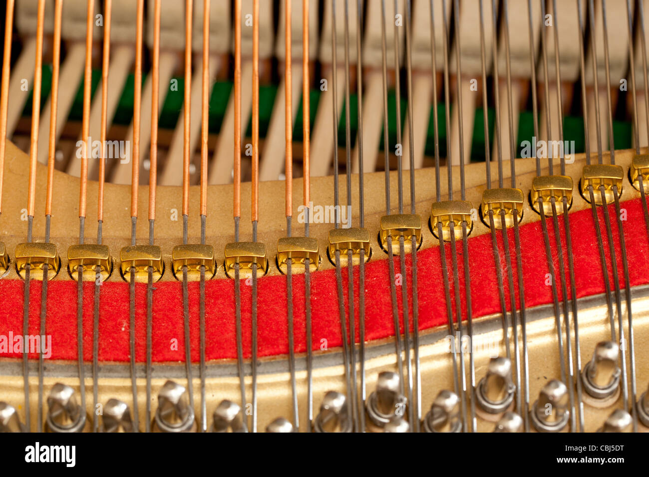 Close up image of interior of grand piano showing strings and structure ...