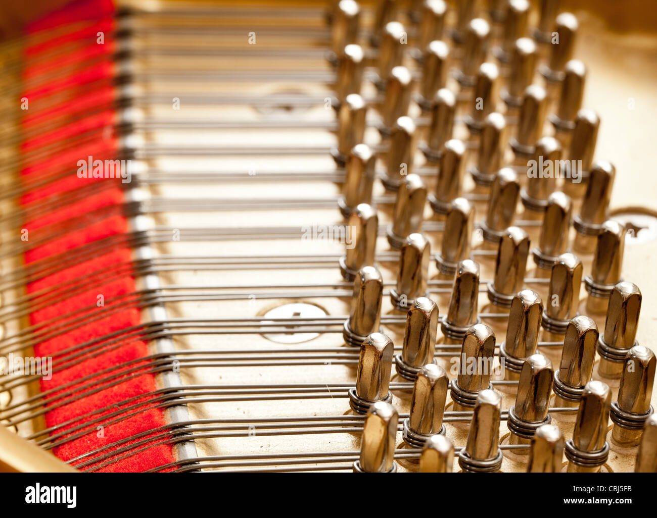 Close up image of interior of grand piano showing strings and structure ...