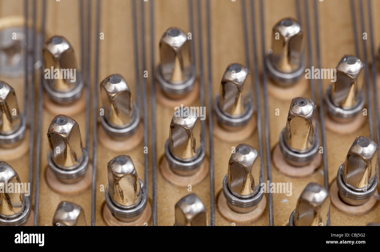 Close up image of interior of grand piano showing strings and structure ...