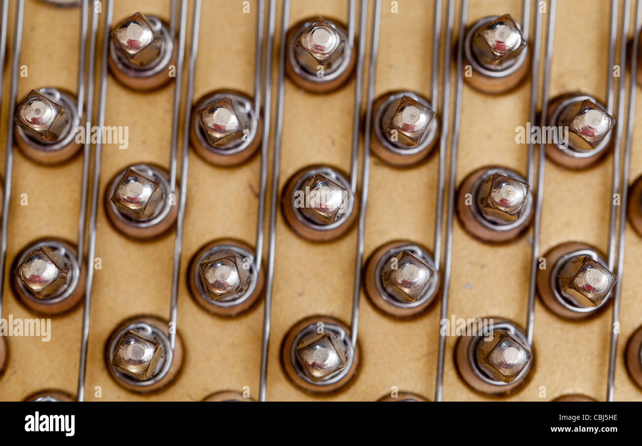Close up image of interior of grand piano showing strings and structure ...