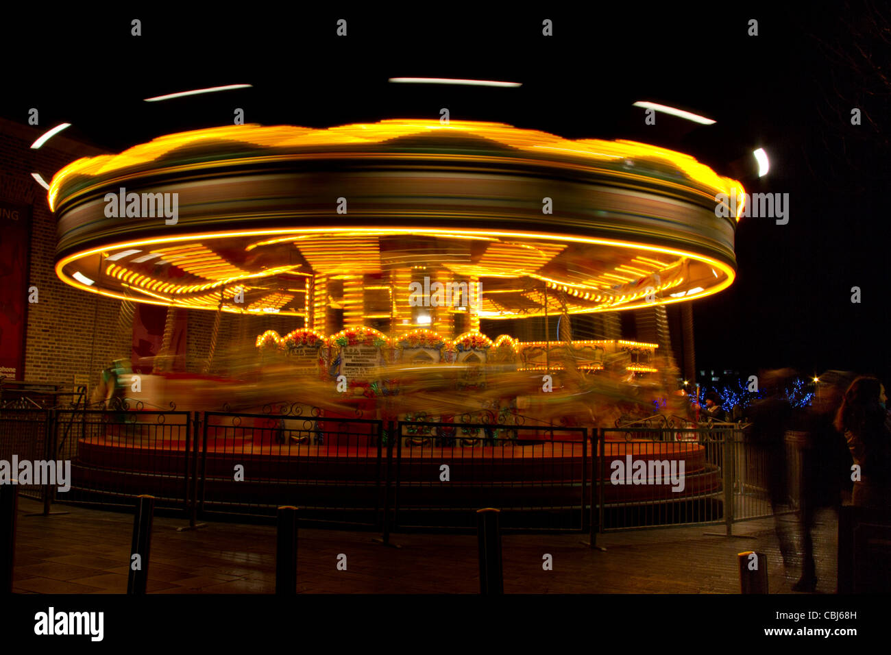 Carousel in motion at night Dublin, Ireland Stock Photo - Alamy