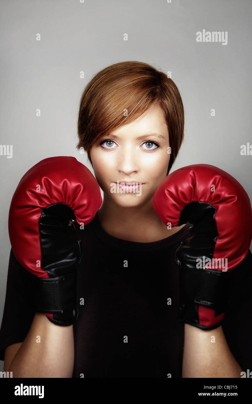 portrait of a good looking woman with boxing gloves Stock Photo - Alamy