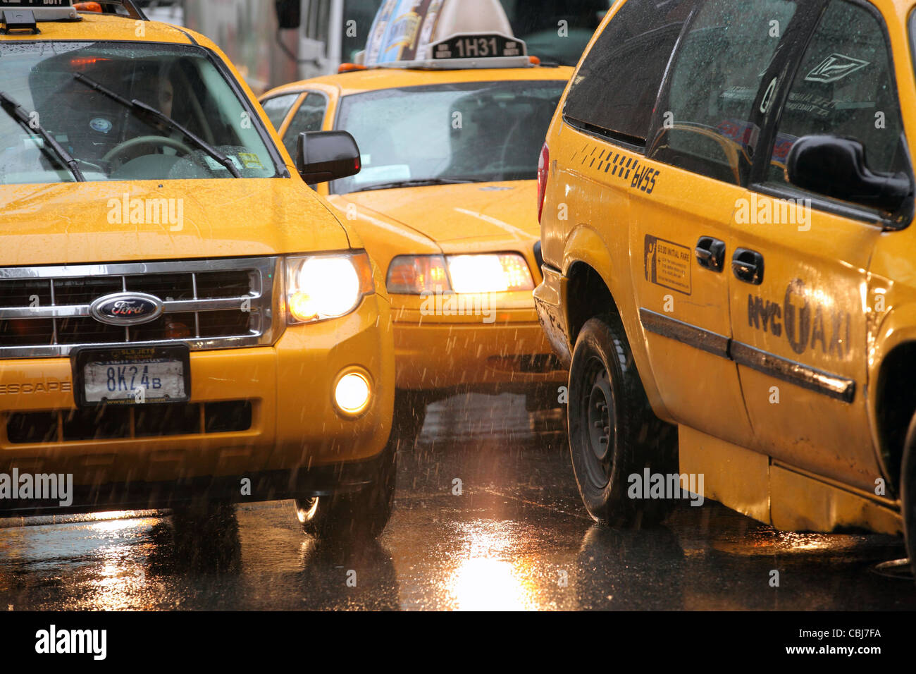 Yellow New York City taxi cabs heavy traffic & rain Flatiron district ...