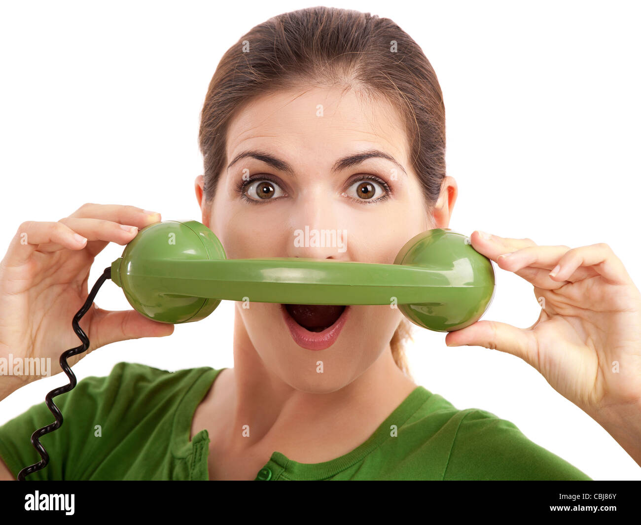 Beautiful woman doing funny faces with a vintage green telephone Stock ...