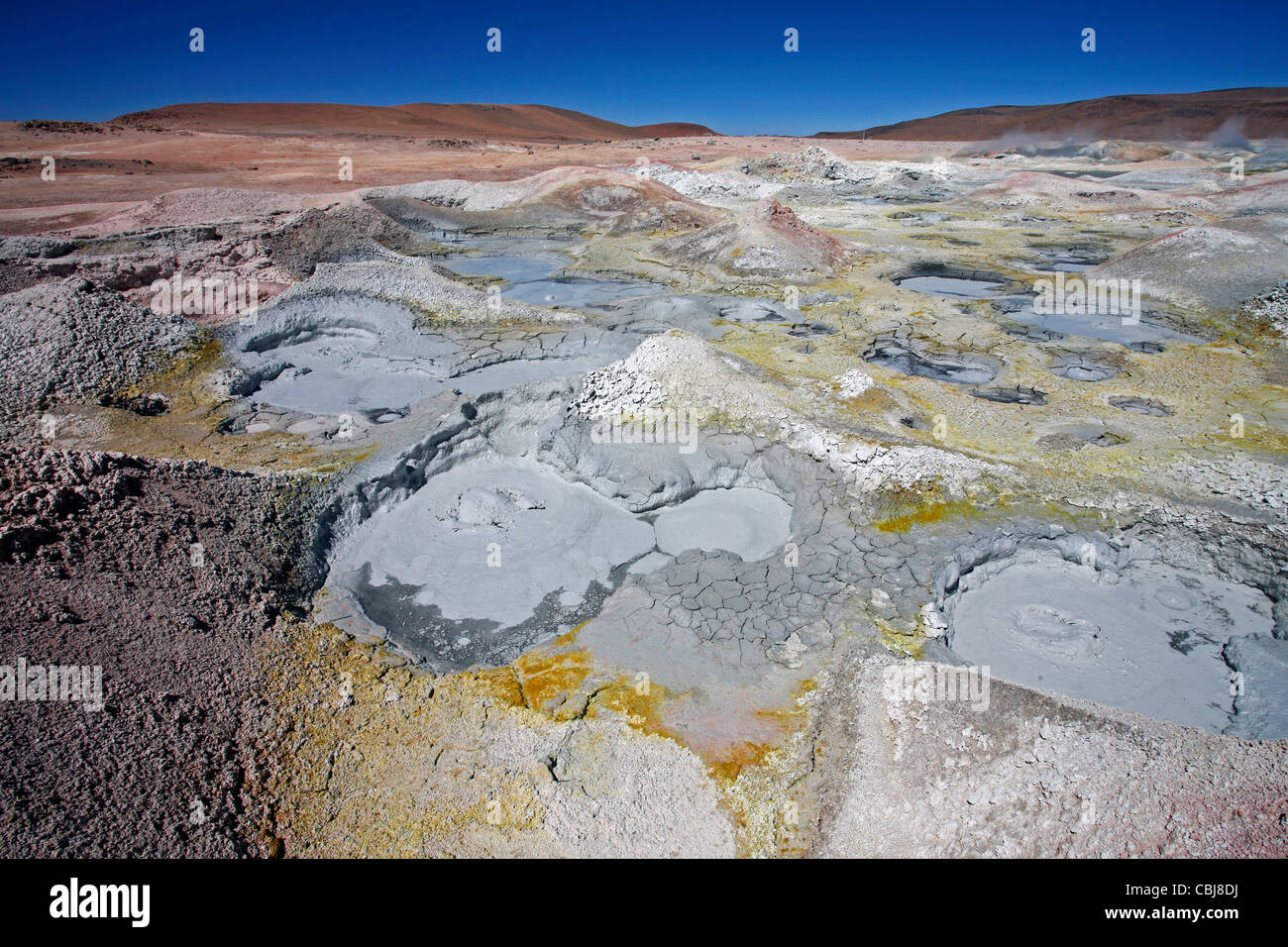 Mud lakes and steam pools with boiling mud in geothermal field Sol de ...