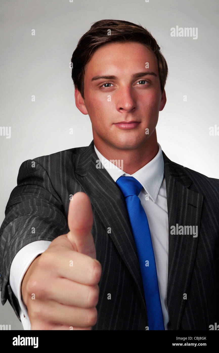 business man with his thumb up saying good job Stock Photo - Alamy