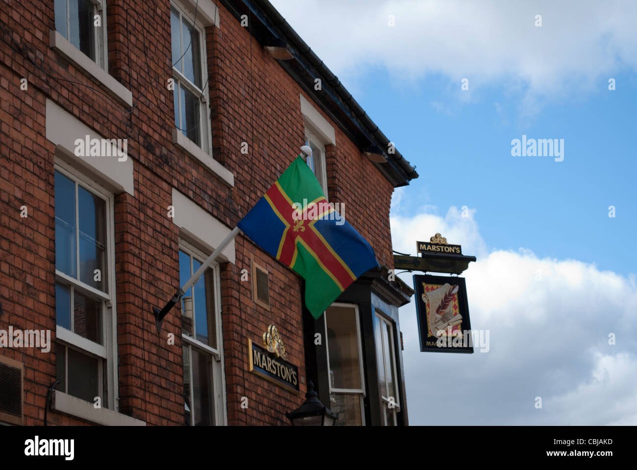 Lincolnshire flag flying from the wall of the Magna Carta pub in ...