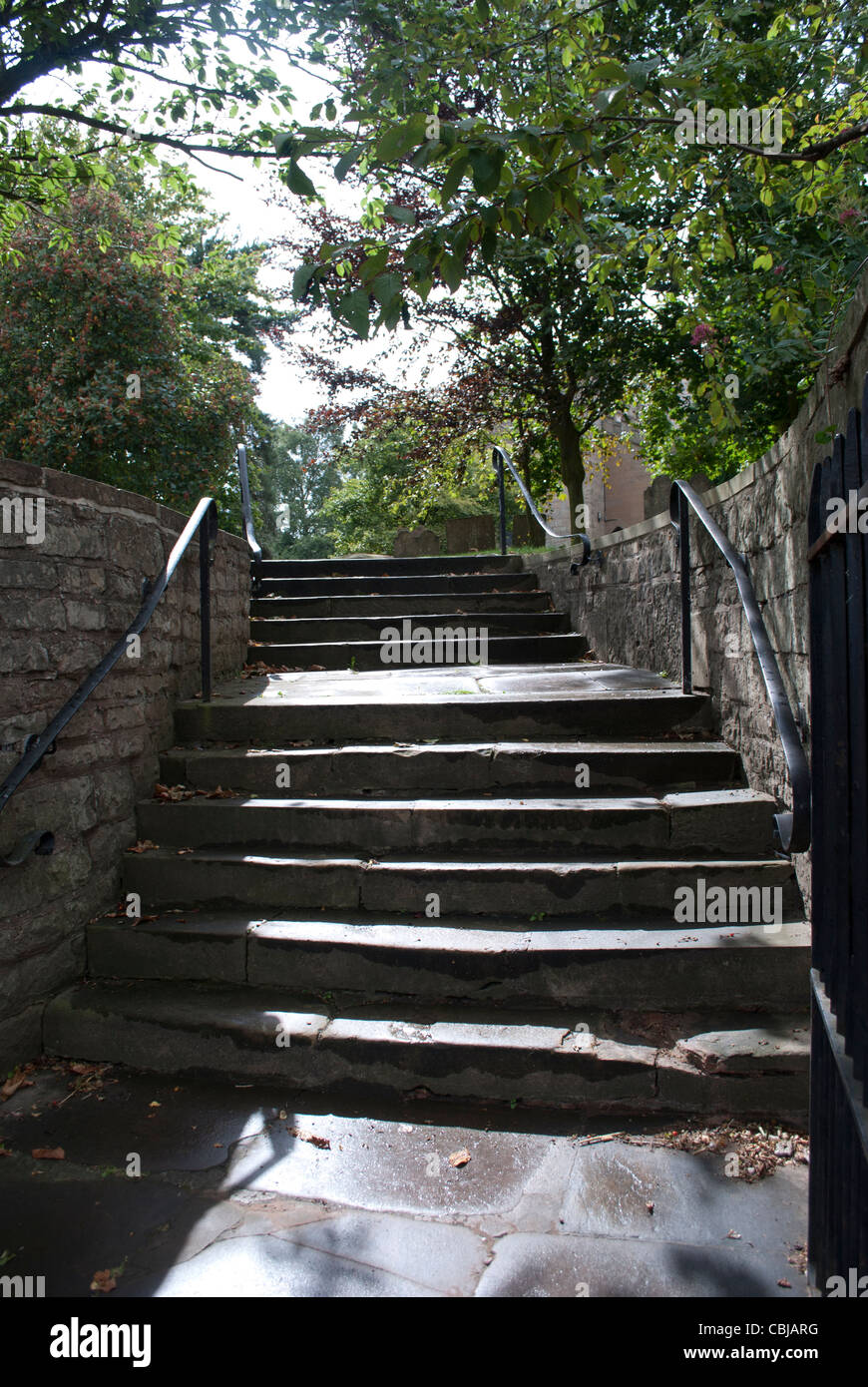 Sunlit stone steps at the entrance to Stock Photo - Alamy