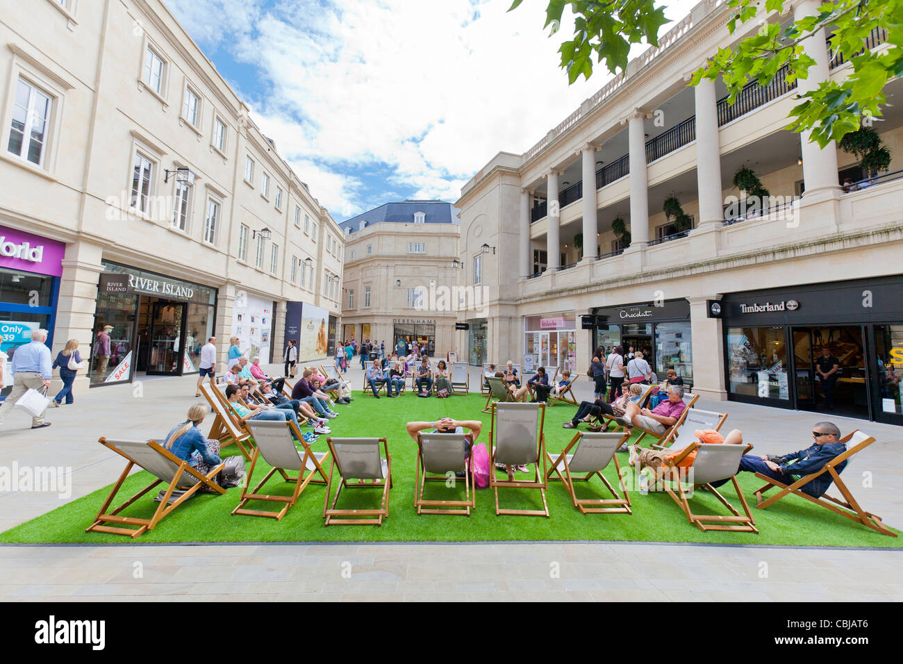 Shoppers walking, sitting, relaxing and resting in the Bath Spa Mall ...