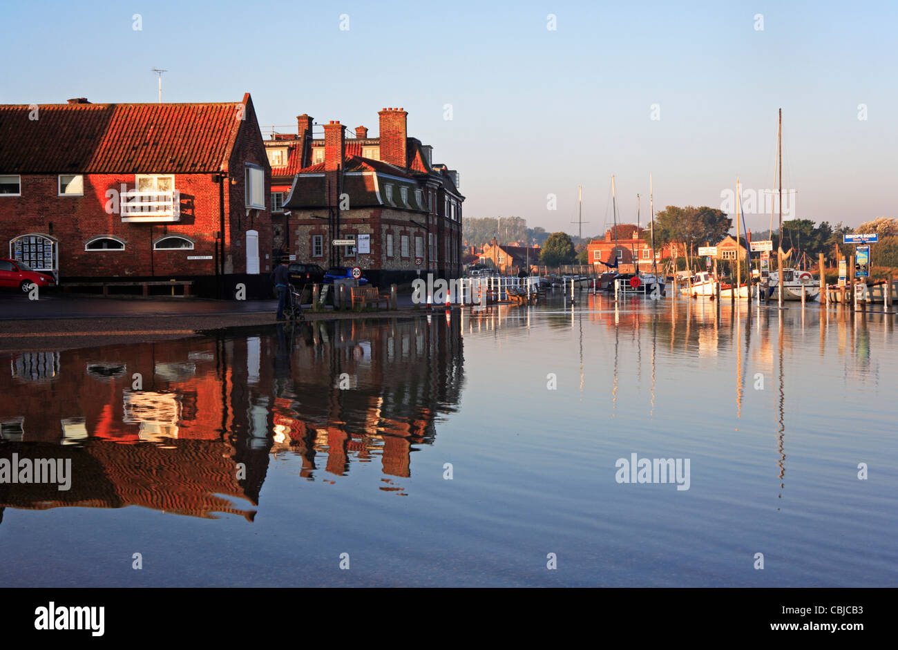 The quay and flooded car park during a spring tide at Blakeney, Norfolk ...