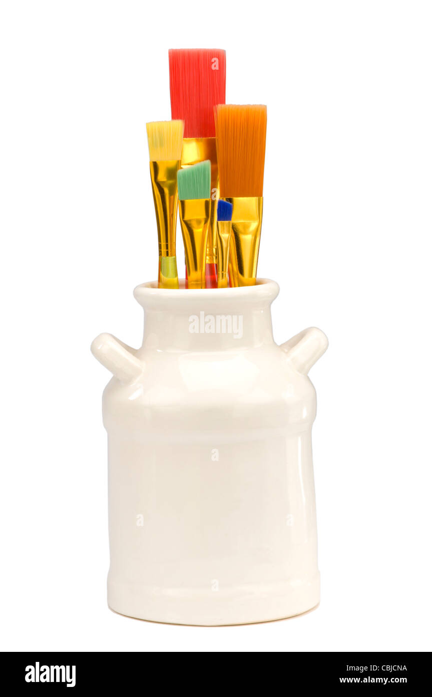Brush into paint jug hi-res stock photography and images - Alamy