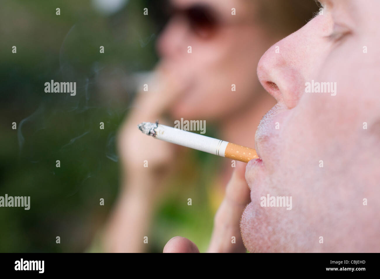 Man smoking a cigarette Stock Photo - Alamy