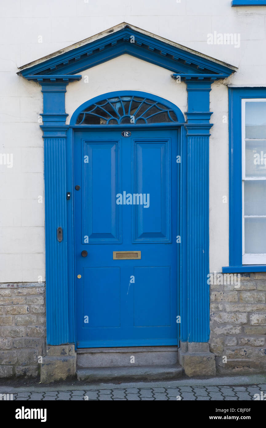 Blue front door No 12 with fanlight and triangular pediment in Kington ...