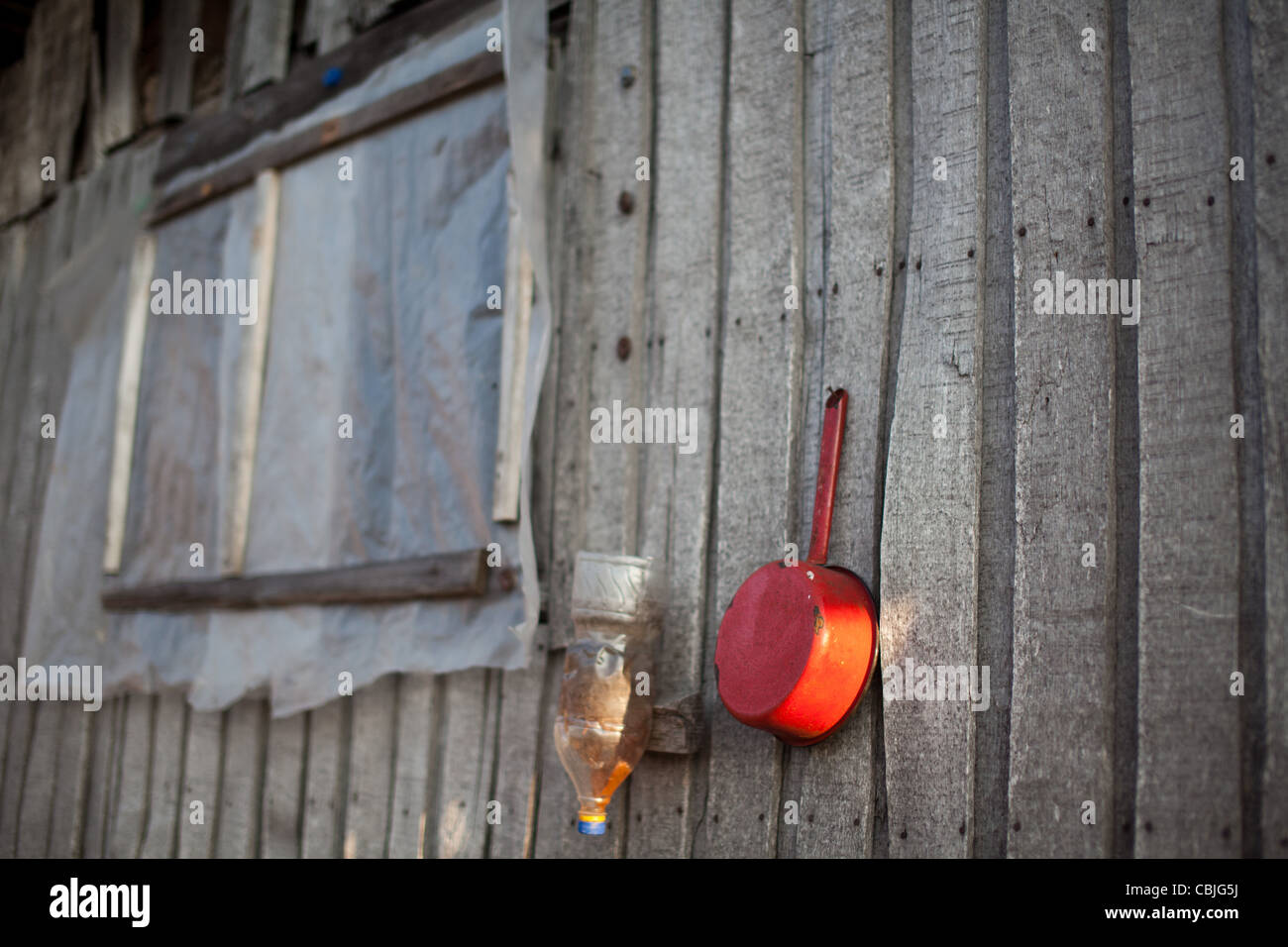 Rusty household objects hanging on wooden barn door Stock Photo - Alamy
