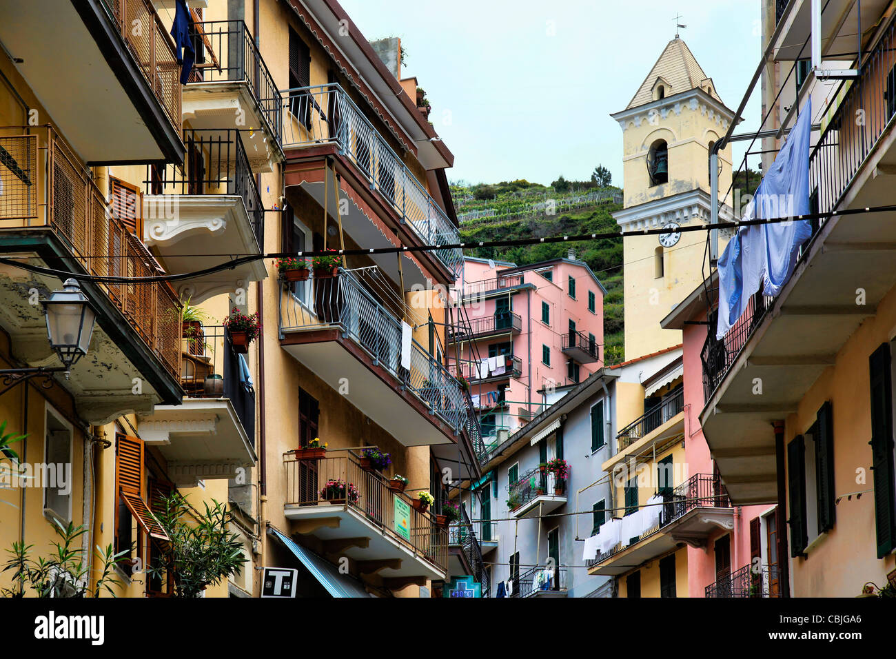 Balconies and church in the village of Manarola in the Cinque Terre ...