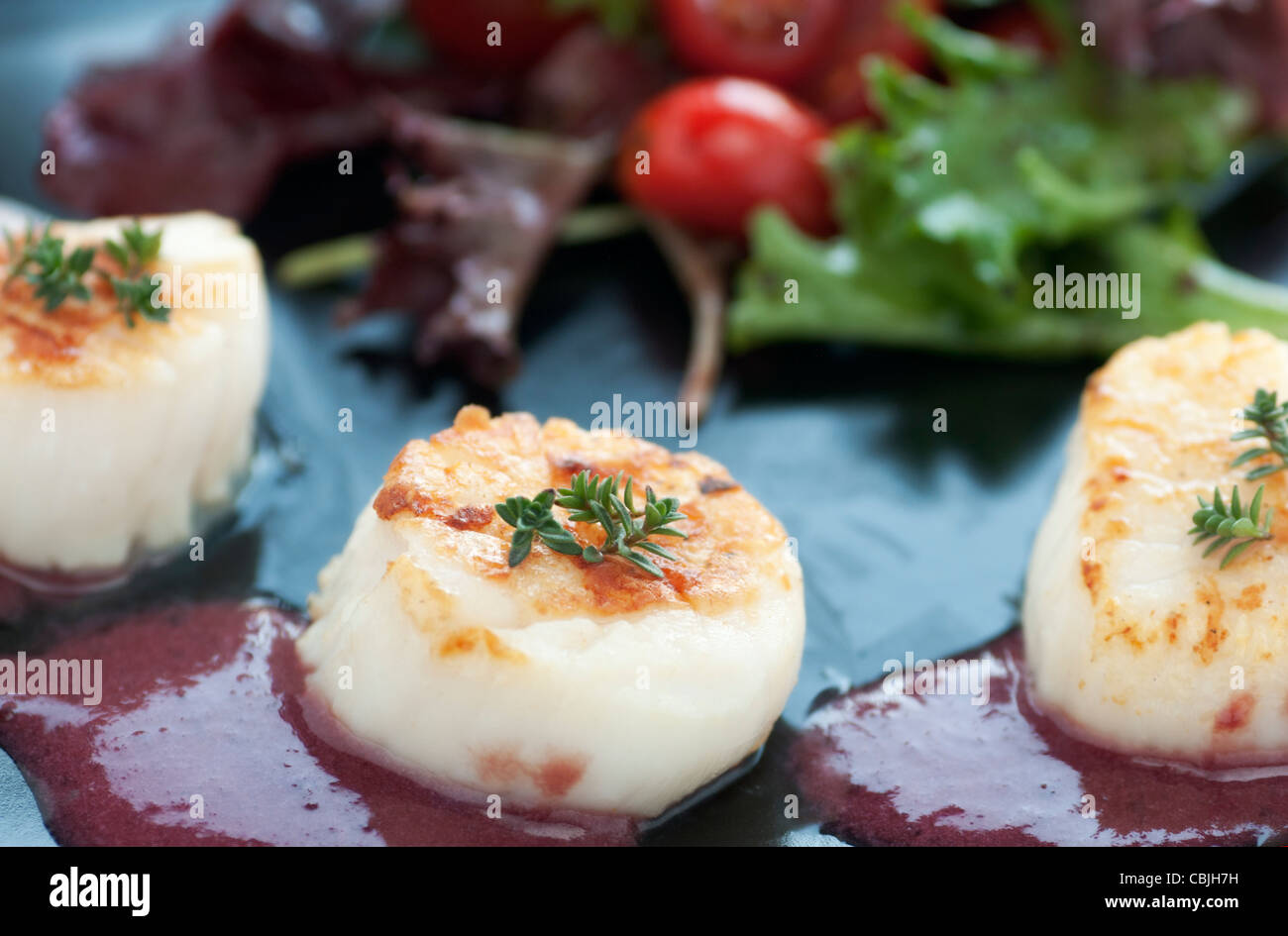 Perfectly seared scallop starter with bright cranberry and balsamic ...
