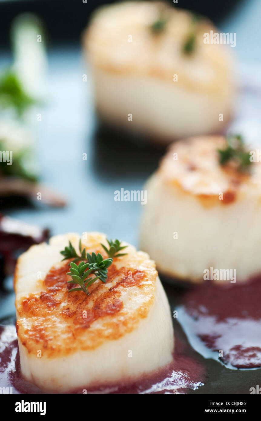 Perfectly seared scallop starter with bright cranberry and balsamic ...