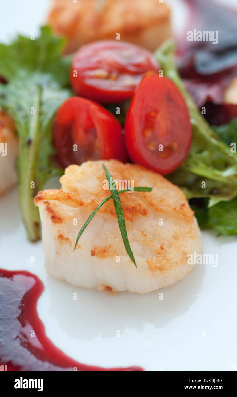 Perfectly seared scallop starter with bright cranberry and balsamic ...