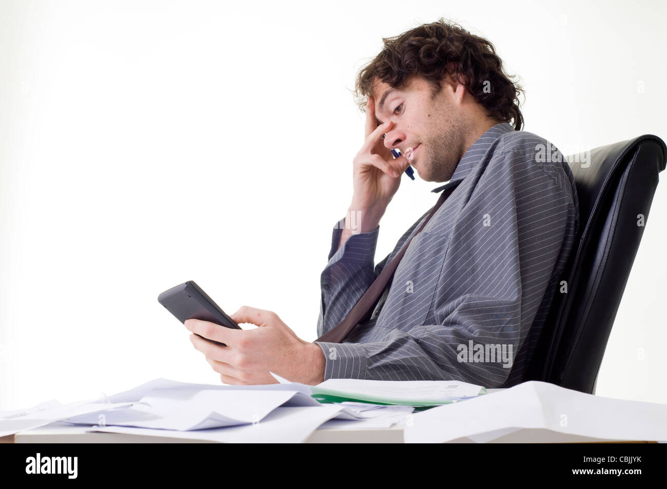 Man stressed doing paper work Stock Photo - Alamy