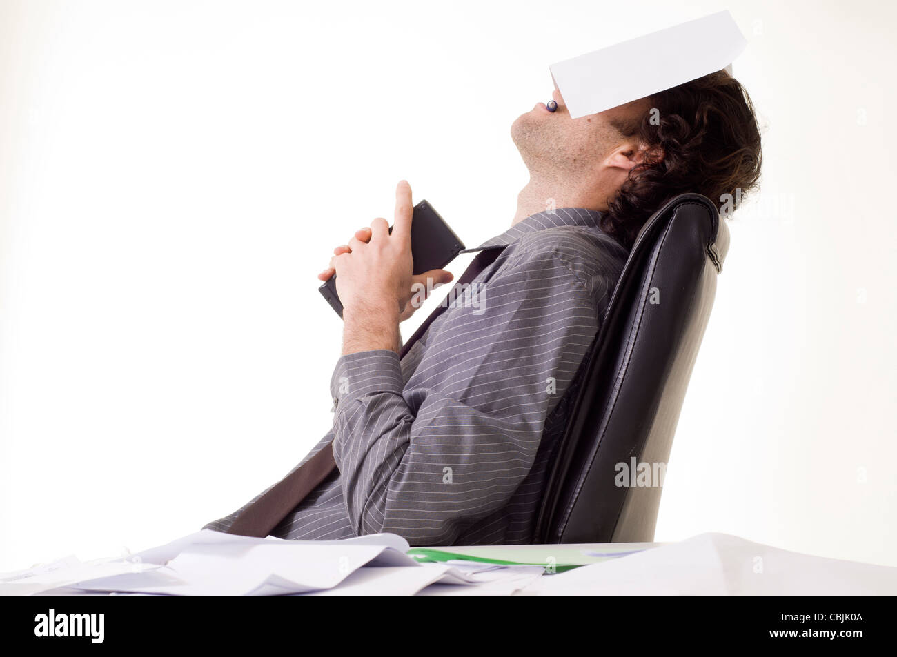 Man stressed doing paper work Stock Photo - Alamy