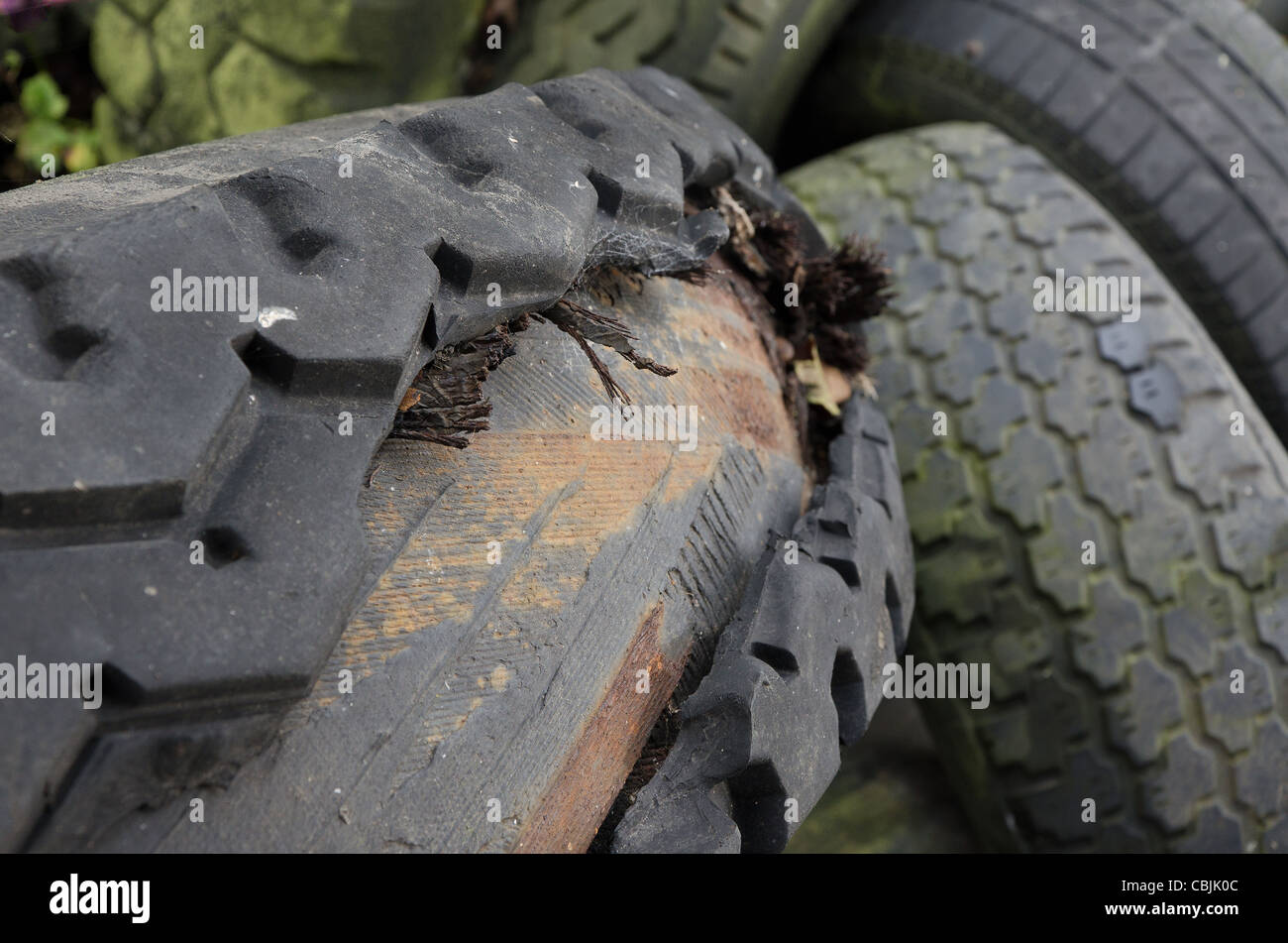 Worn out tyres with radial reinforcement showing through failed tread ...