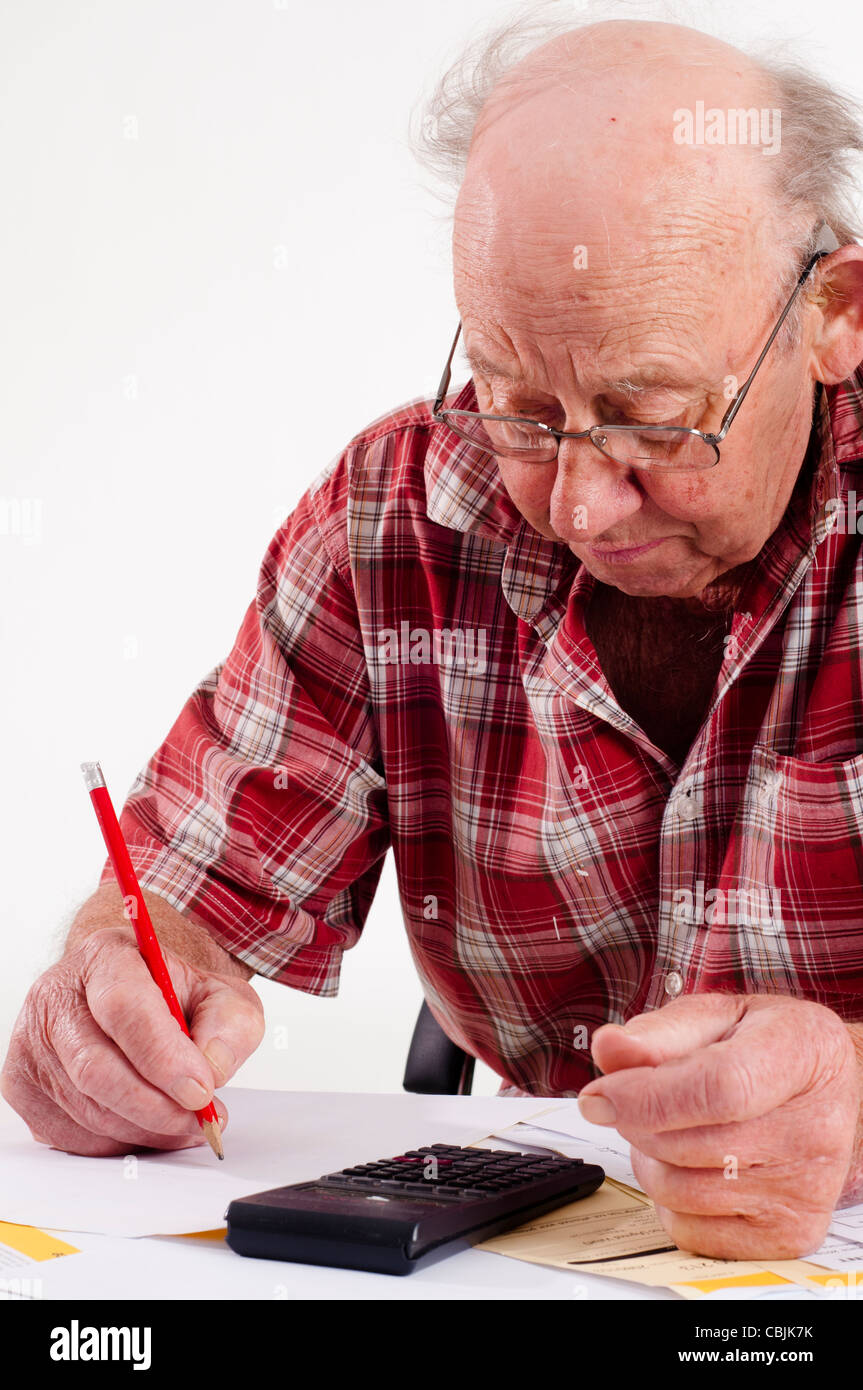 old Man calculating paper work Stock Photo - Alamy