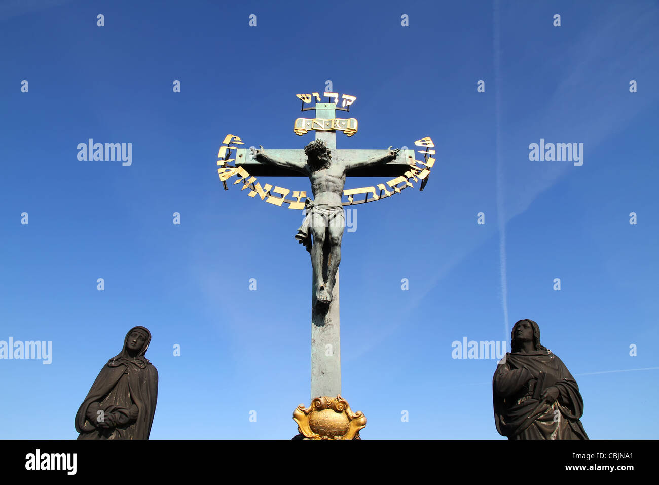 A cross on the Charles Bridge in Prague, Czech republic Stock Photo - Alamy