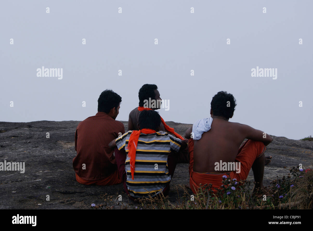 Four Native friends relaxing after mountaineering on the Top Most Peak ...