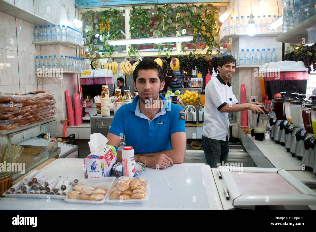 Employees at a juice bar in the bazaar of the Kurdish city of Duhok in ...