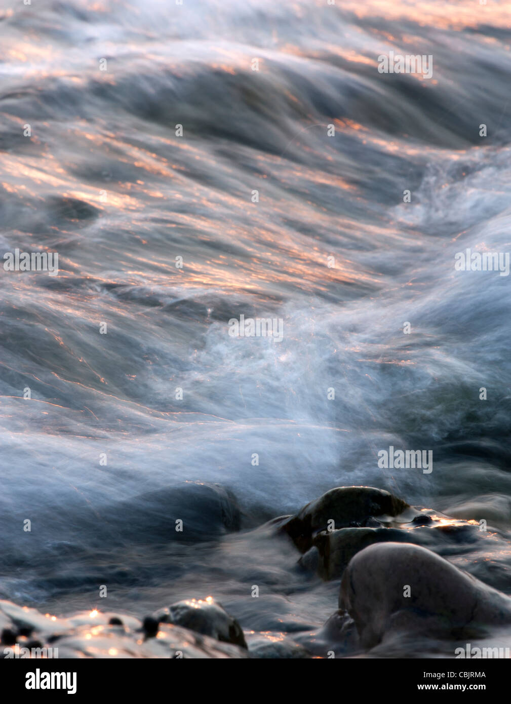 Wire shape waves at sunrise Stock Photo - Alamy