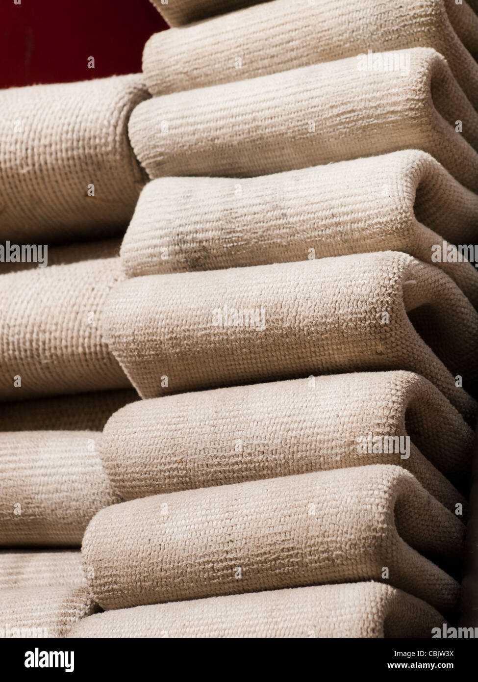 Fire hoses folded in fire truck Stock Photo - Alamy