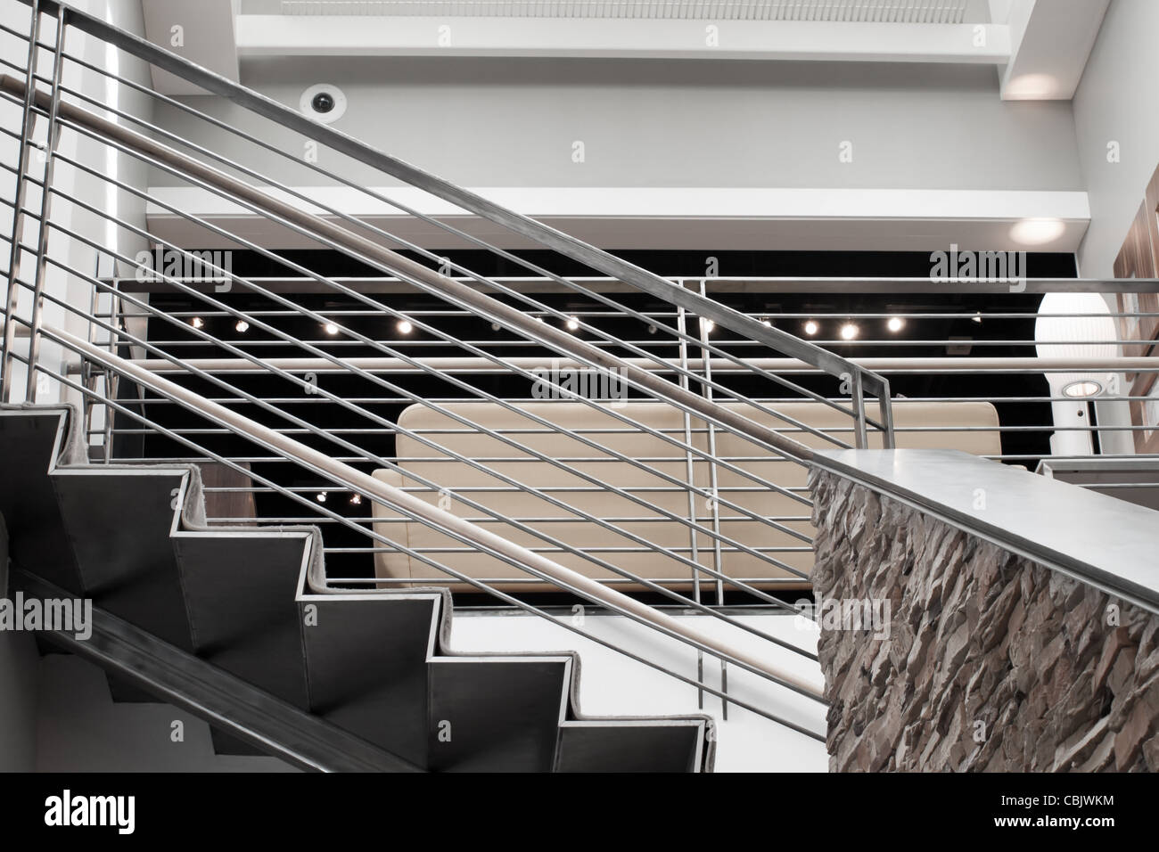 metal contemporary stair with stone wall Stock Photo - Alamy