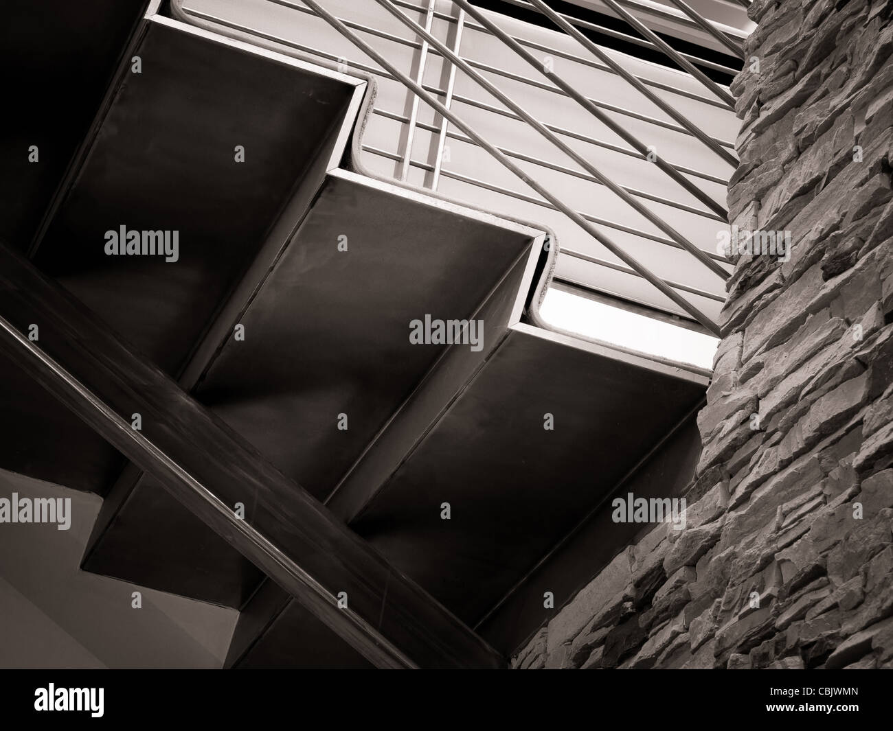metal contemporary stair with stone wall Stock Photo - Alamy