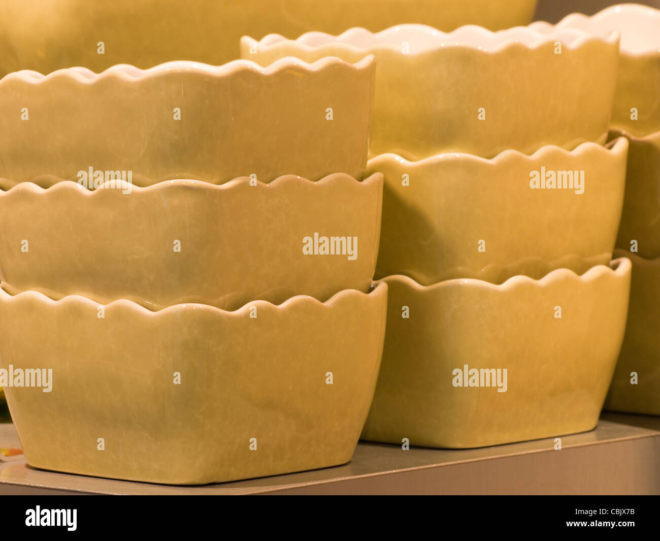 Green ramekins in stack on the display Stock Photo - Alamy
