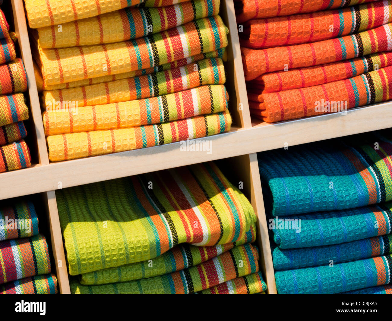 Stack of color kitchen towels on display Stock Photo - Alamy