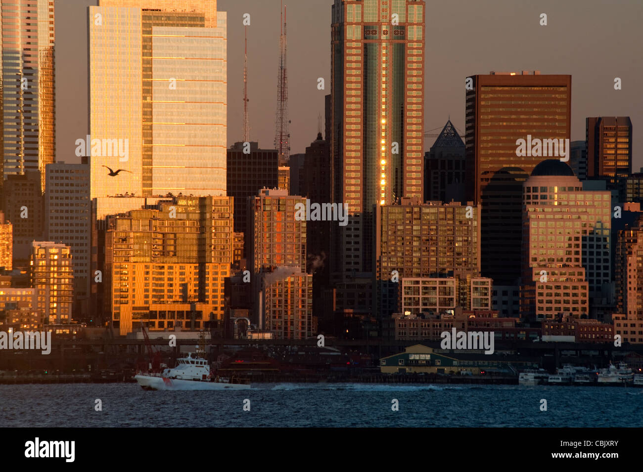 A beautiful Seattle sunset is reflected in the facades of the glass ...