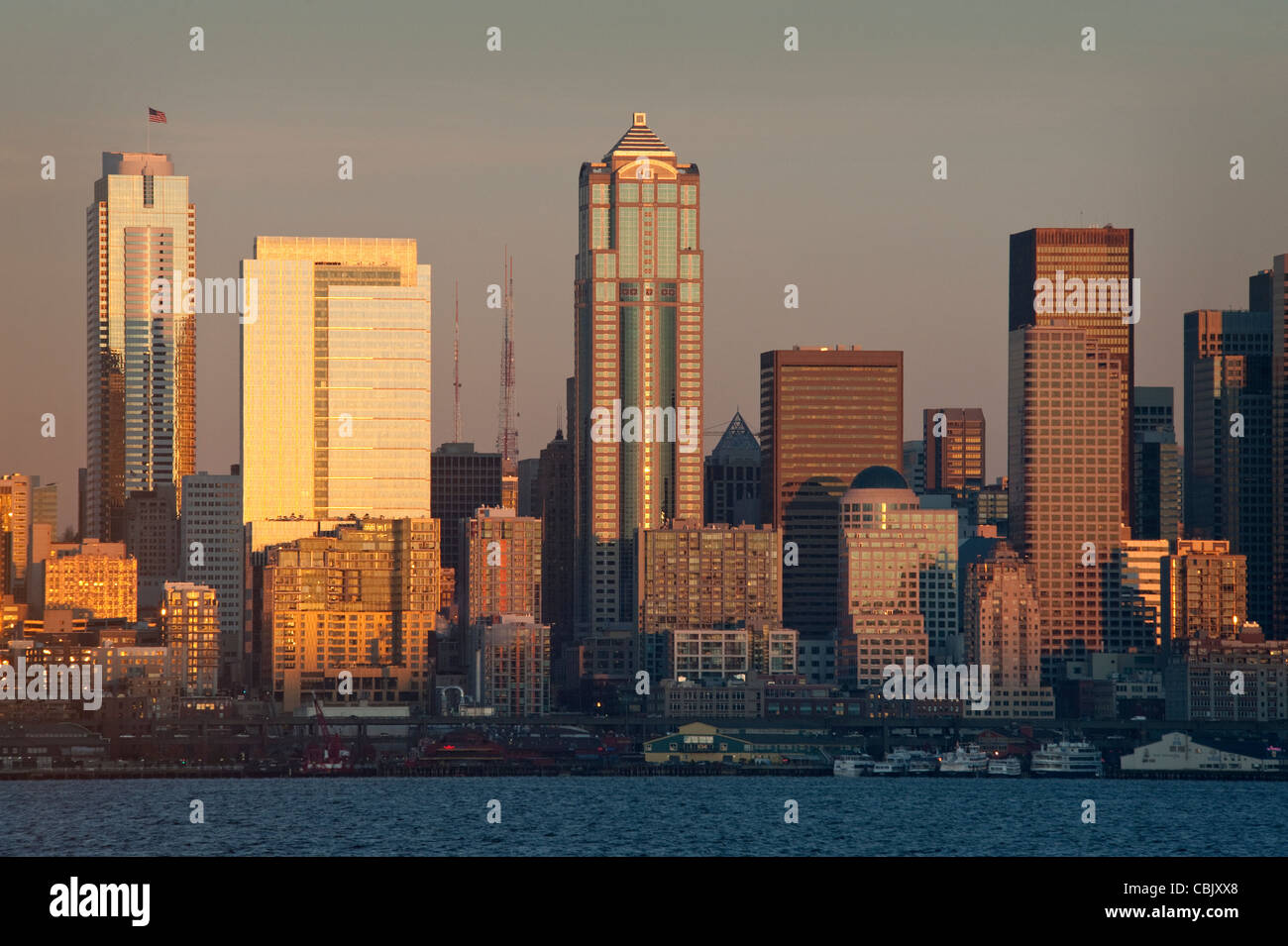 Tall buildings reflected in the ocean hi-res stock photography and ...