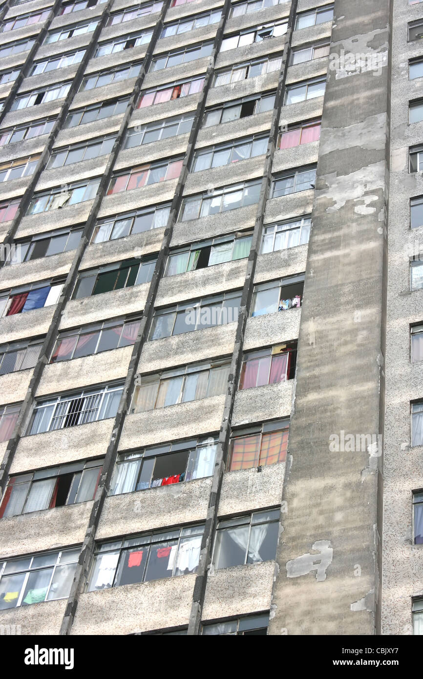 Facade of a rundown building in a poor neighborhood in the center of ...