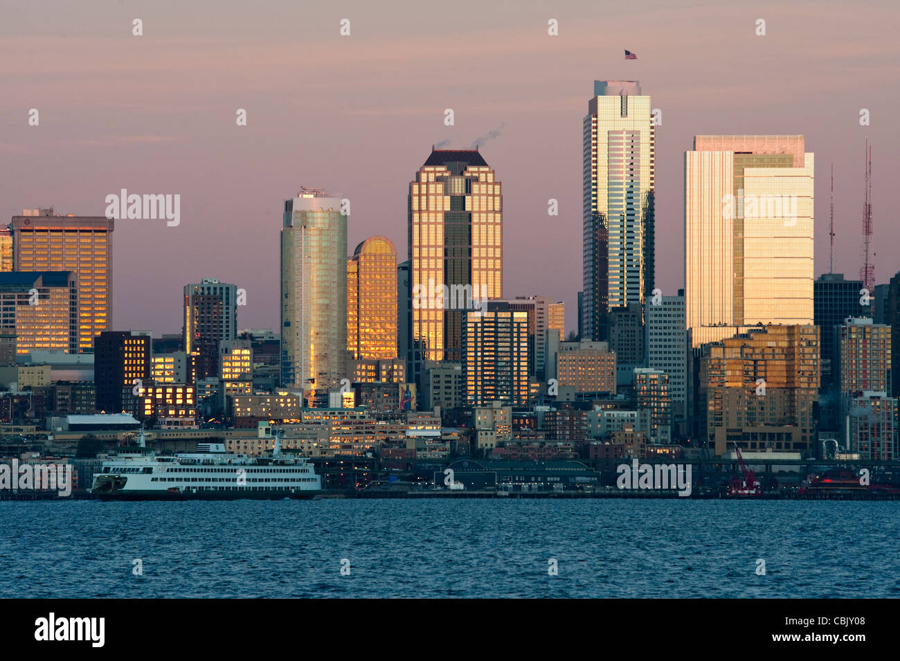 A beautiful Seattle sunset is reflected in the facades of the glass ...