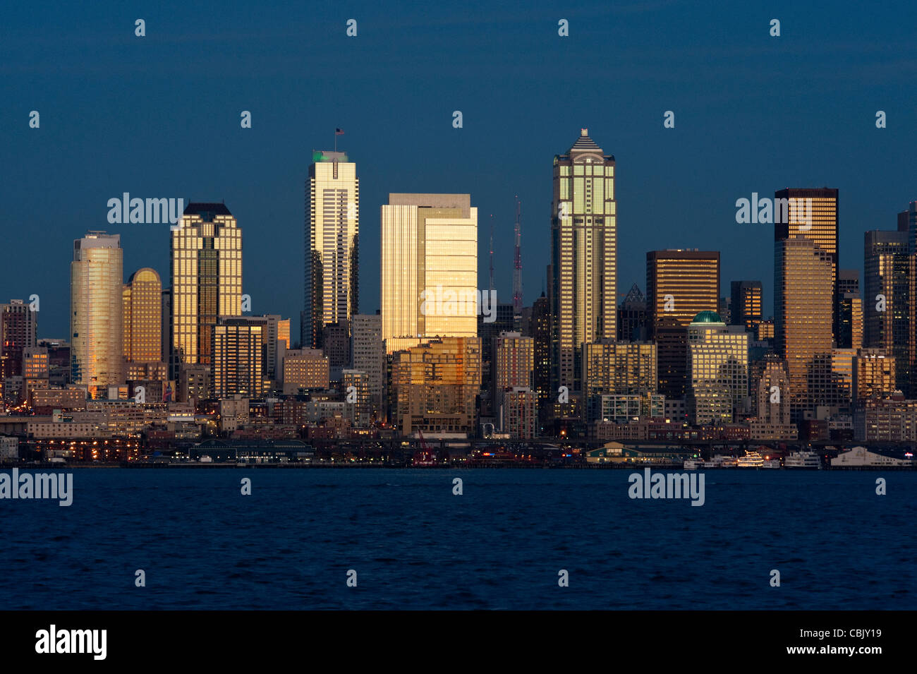 A beautiful Seattle sunset is reflected in the facades of the glass ...