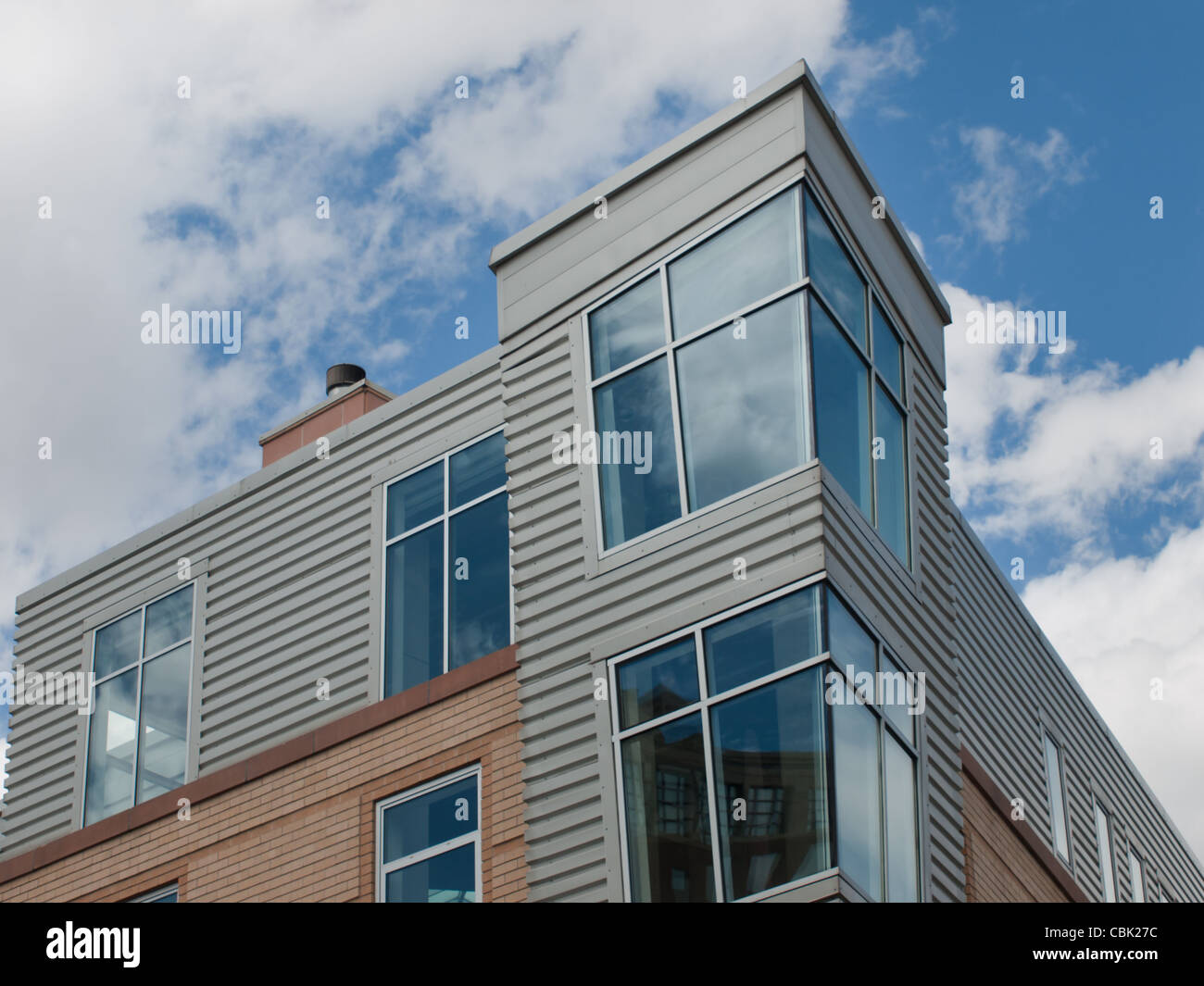 A modern condo building with an unusual shaped corner in Denver ...