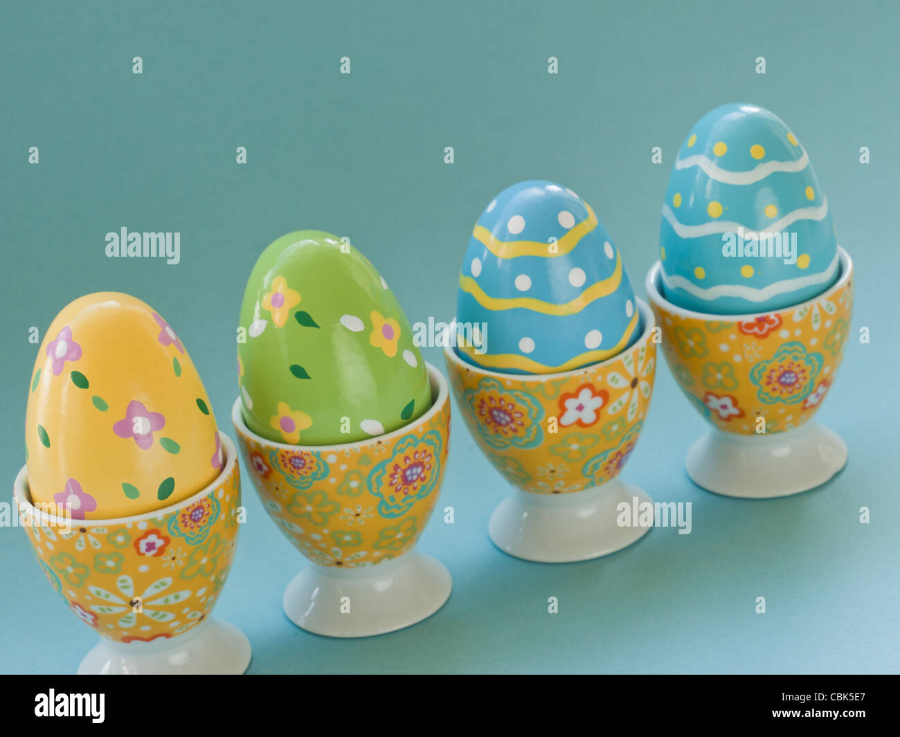 Painted easter eggs in egg cups Stock Photo - Alamy