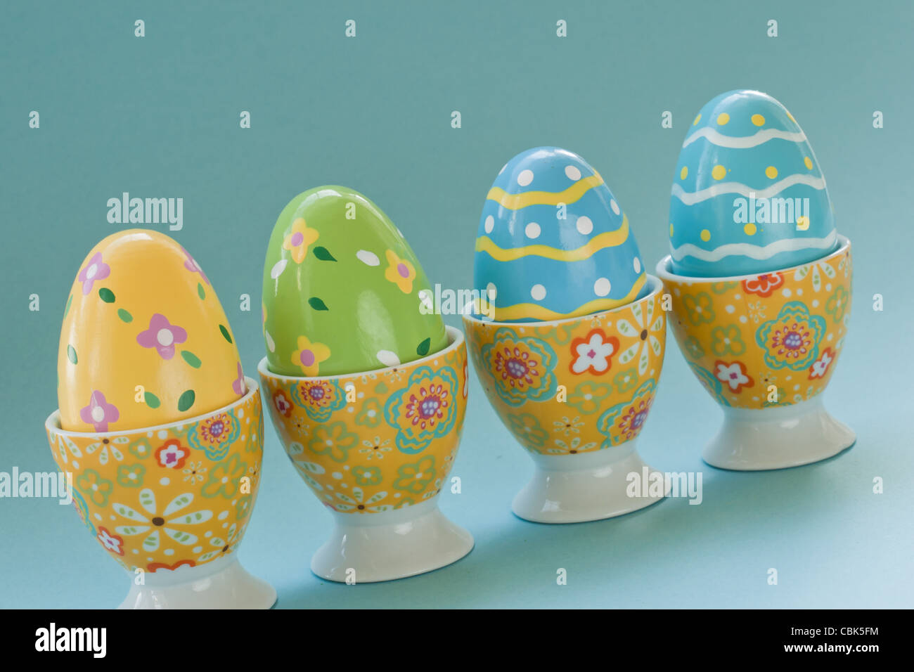 Painted easter eggs in egg cups Stock Photo - Alamy