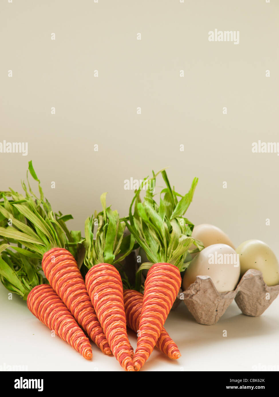 Spring carrots and painted easter eggs Stock Photo - Alamy